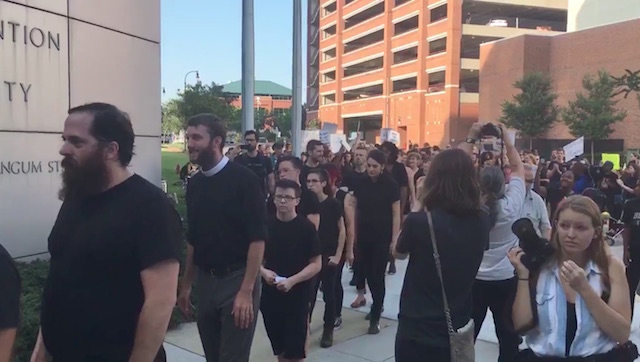 Crowds Of People Turn Themselves In to Police For Tearing Down ...