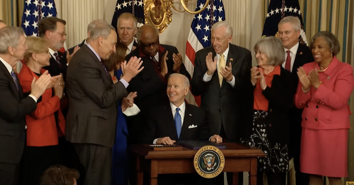 President Biden Signs 'Historic' Bill to Reform the U.S. Postal Service ...