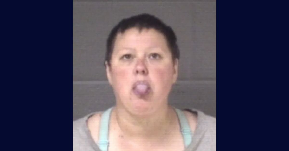 Danya Kathryn Dewey sticks tongue out in booking photo after being ...